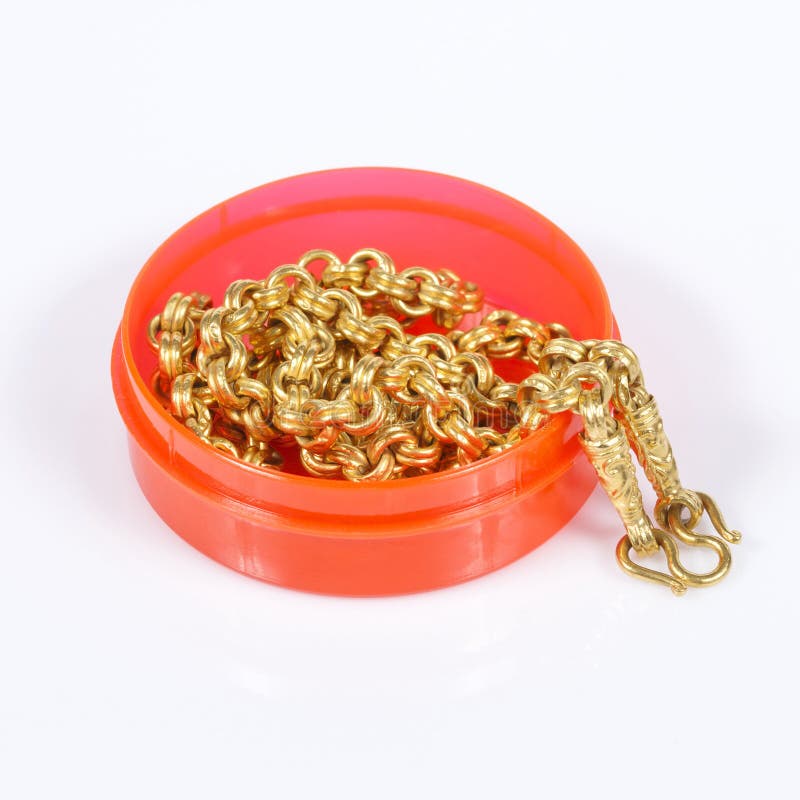 Gold Necklace in Circle Container on White Stock Image - Image of ...