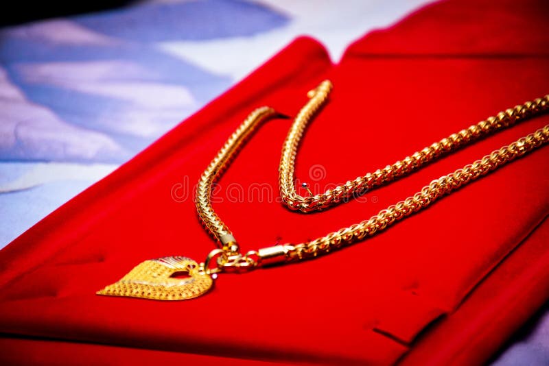 Gold necklace in red box stock photo. Image of special - 179043490