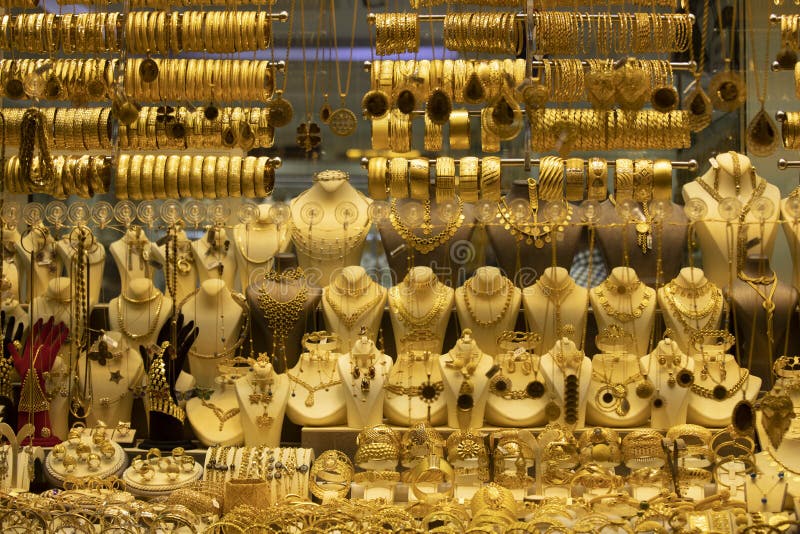 Gold Necklaces and Bracelets Designed in Various Ways in Front of the ...
