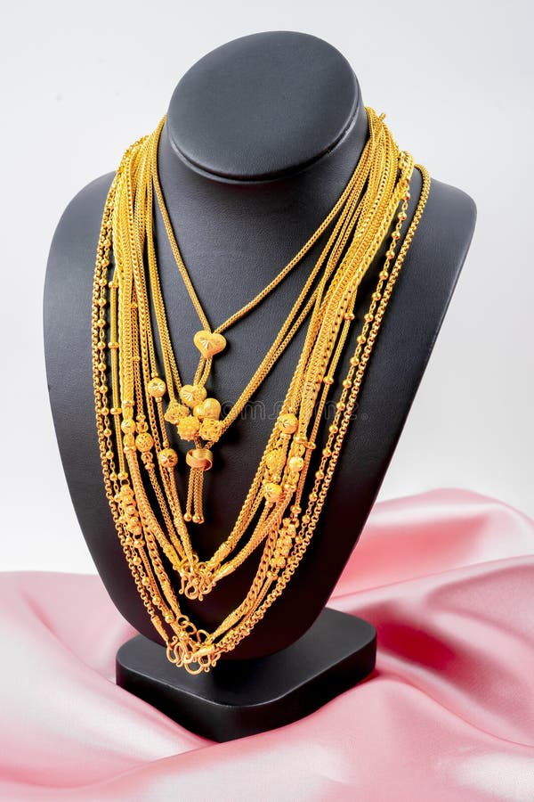 The Necklace Display Stand with Gold Necklace on Black Background Stock ...