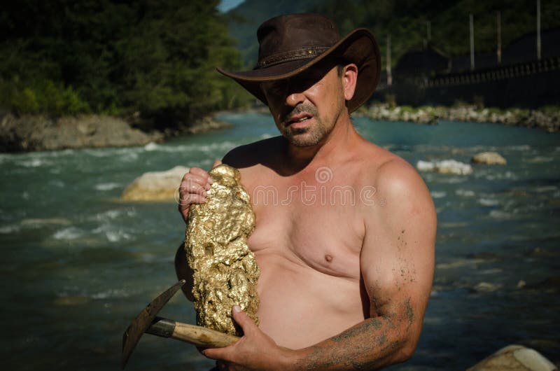 Gold miner, with nugget. stock image. Image of people - 78311399
