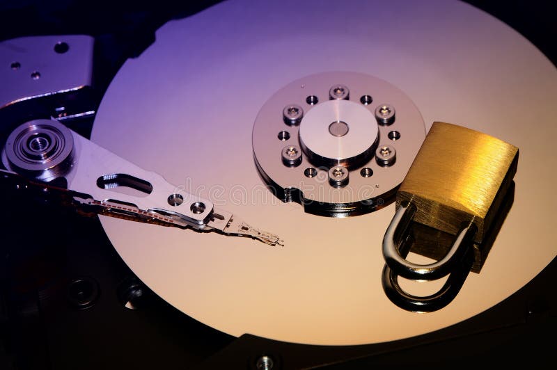 Gold Padlock on the Opened HDD Disk Drive Surface. Data Protection or ...
