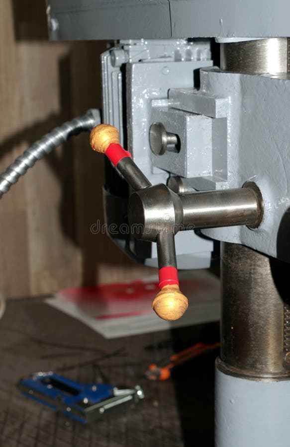 Gold-painted Handles on a Drilling Machine. Stock Photo - Image of ...