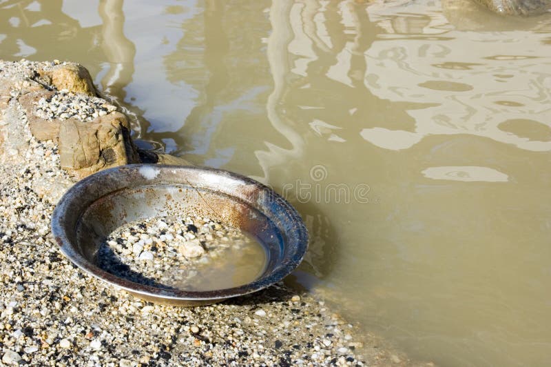 Gold pan with gold nuggets stock photo. Image of rich - 4358264