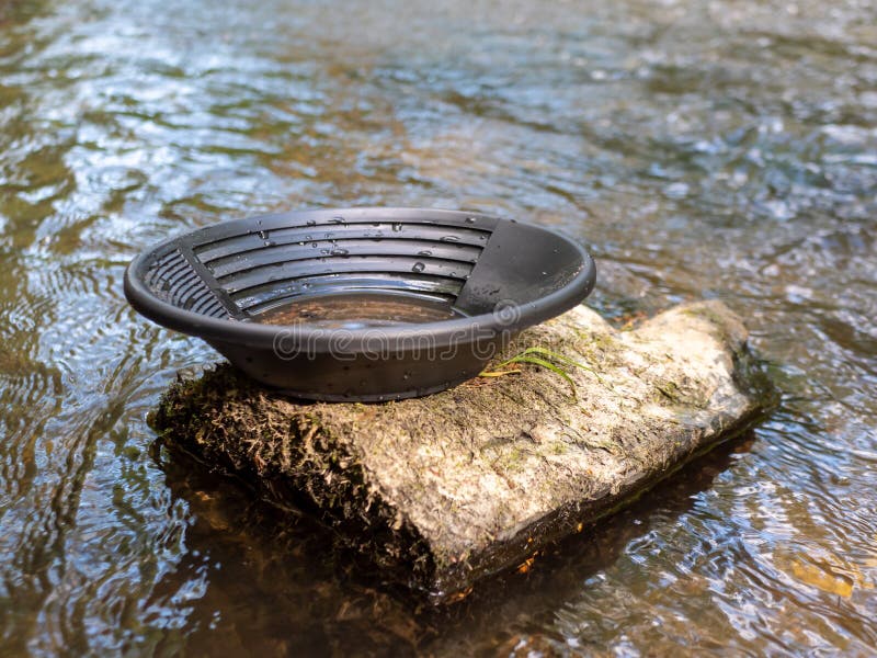 Gold pan for gold panning stock image. Image of flow - 248068099