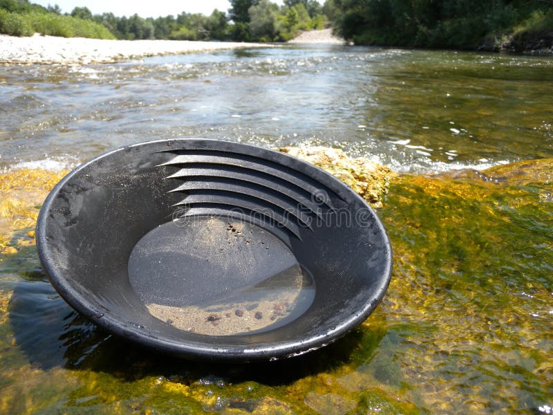 Gold pan with gold nuggets stock photo. Image of rich - 4358264