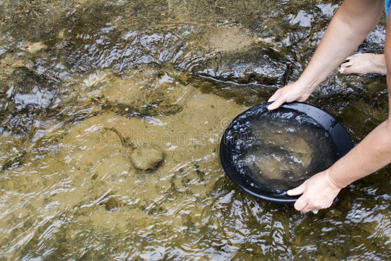 Gold panning for gold stock photo. Image of hand, geology - 1122580