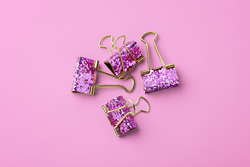 Gold Paper Clips with Glitter on Pink Background Stock Image - Image of ...