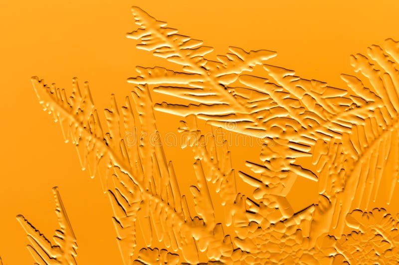 Gold Patterns from Frost on Glass As a Background Stock Photo - Image ...