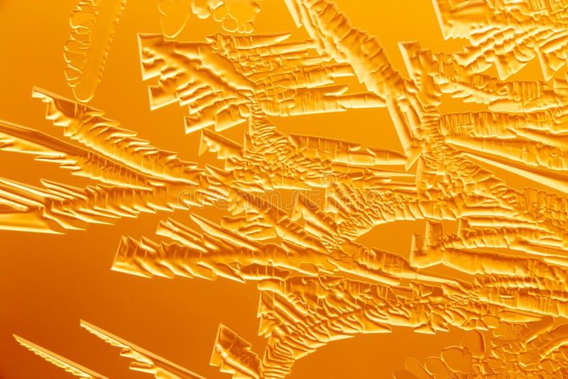 Gold Patterns from Frost on Glass As a Background Stock Image - Image ...