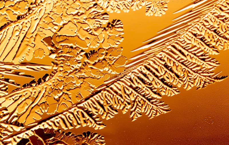 Gold Patterns from Frost on Glass As a Background Stock Photo - Image ...