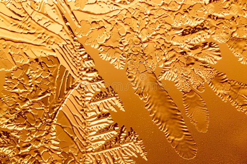Gold Patterns from Frost on Glass As a Background Stock Image - Image ...