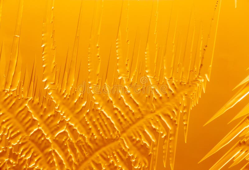 Gold Patterns from Frost on Glass As a Background Stock Photo - Image ...