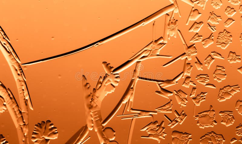 Gold Patterns from Frost on Glass As a Background. Stock Image - Image ...