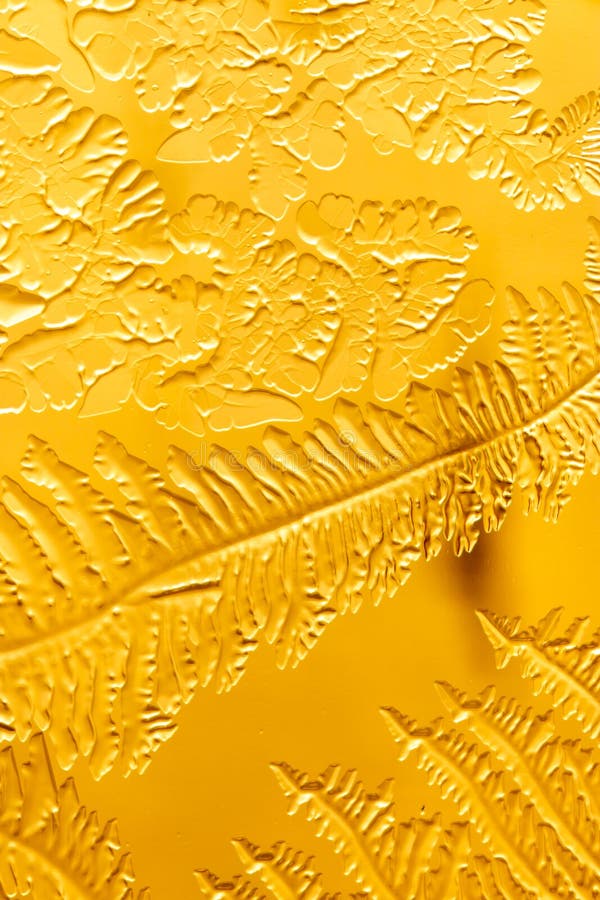 Gold Patterns from Frost on Glass As a Background. Stock Photo - Image ...