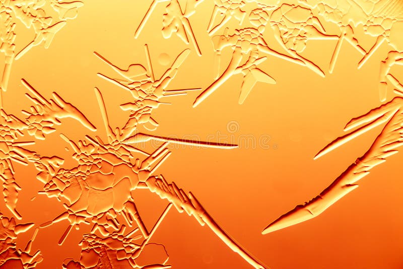 Gold Patterns from Frost on Glass As a Background. Stock Photo - Image ...