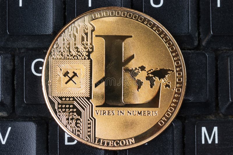 Gold Physical Litecoin Cryptocurrency Coin on Computer Keyboard Stock ...
