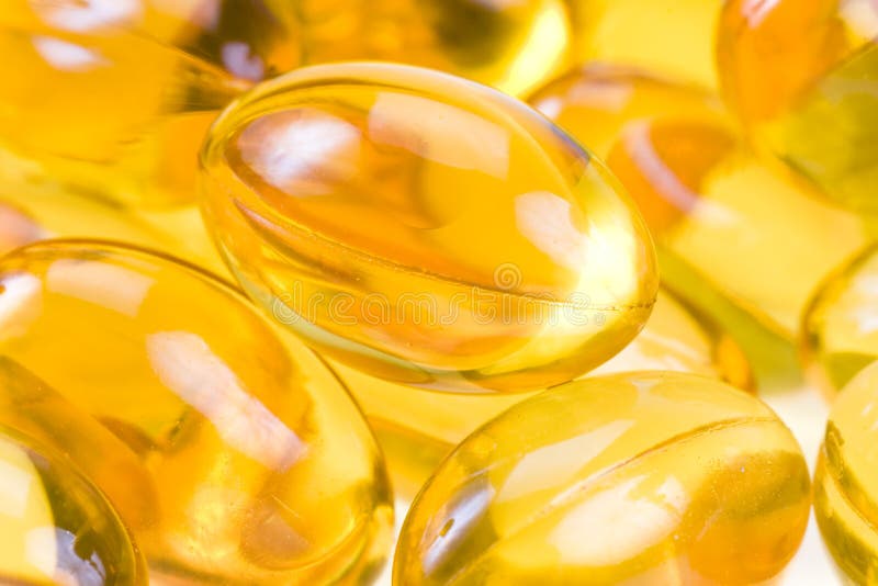 Gold pill macro stock photo. Image of translucent, illness - 18871476