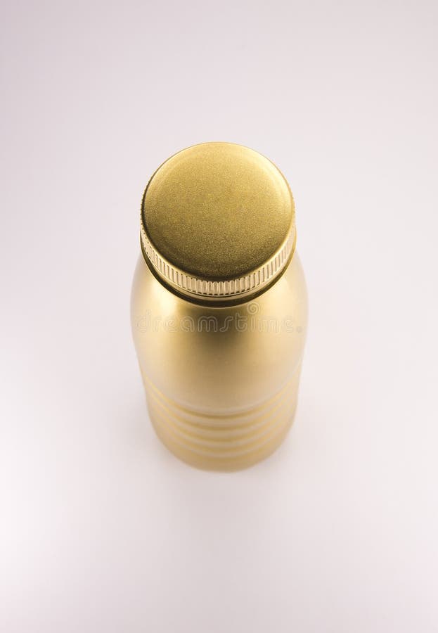 Gold plastic bottle stock photo. Image of container - 118674188