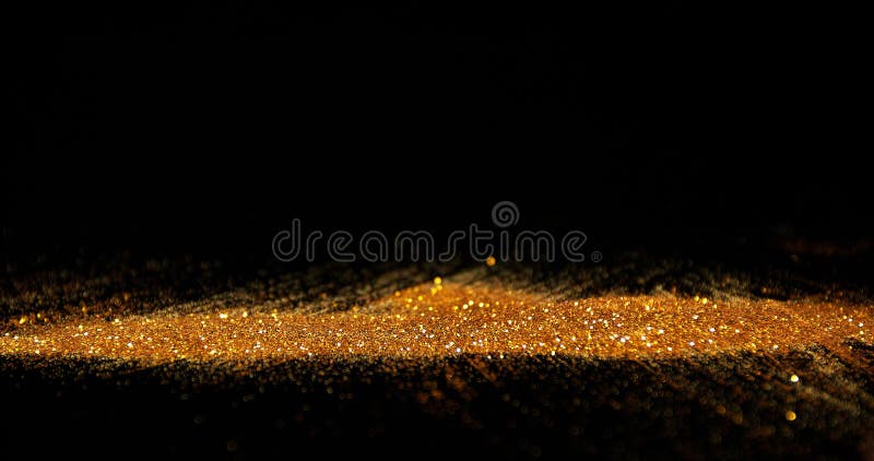 Gold Powder Falling Against Black Background Stock Photo - Image of ...