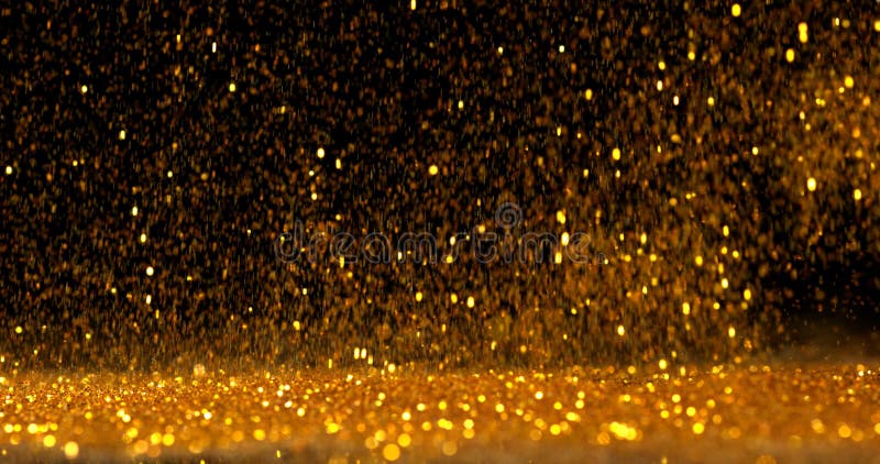 Gold Powder Falling Against Black Background Stock Photo - Image of ...