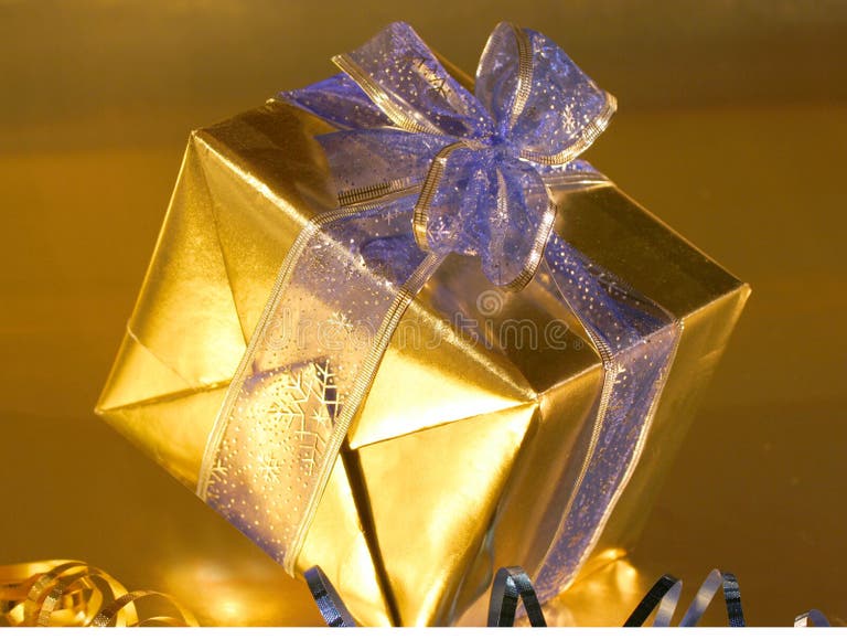 Gold Present with Blue Ribbons Stock Photo - Image of ribbon, gift: 3673890