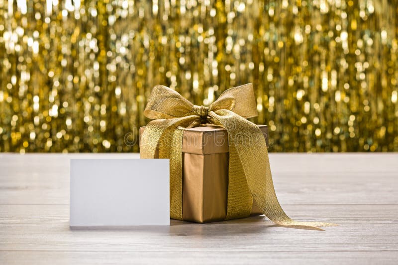 Gold present and holly stock image. Image of elegance - 31986759
