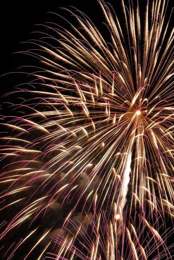 Gold and purple fireworks stock photo. Image of holiday - 3978122