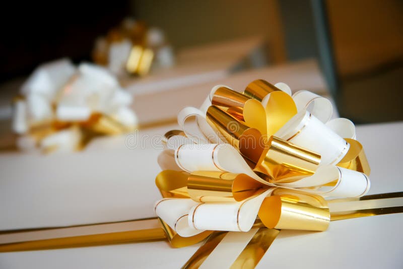 Gold and White Ribbon Gift stock photo. Image of gift - 164018320