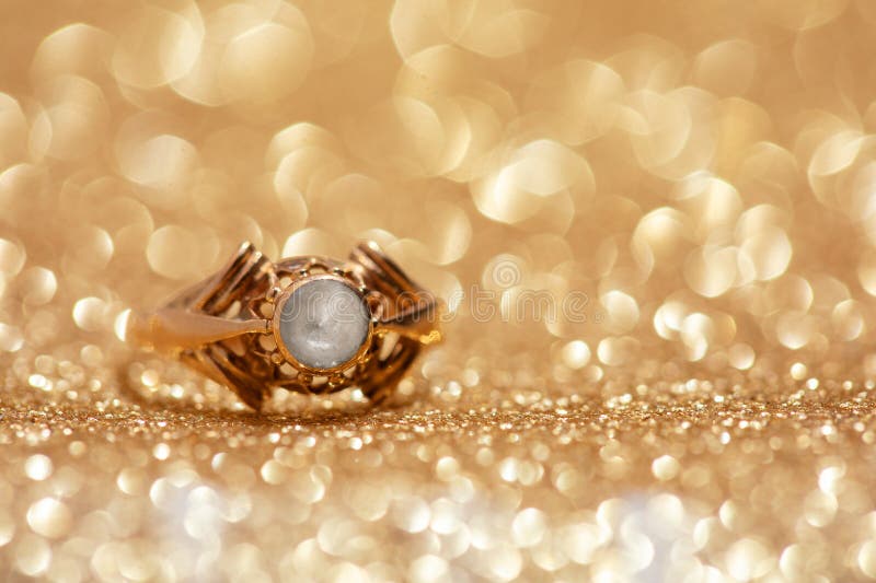 Gold Ring on Gold Background Stock Photo - Image of rings, jewellery ...