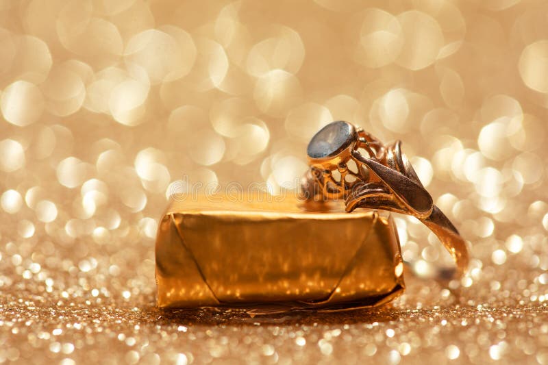 Gold Ring on Gold Background Stock Photo - Image of shiny, brilliant ...