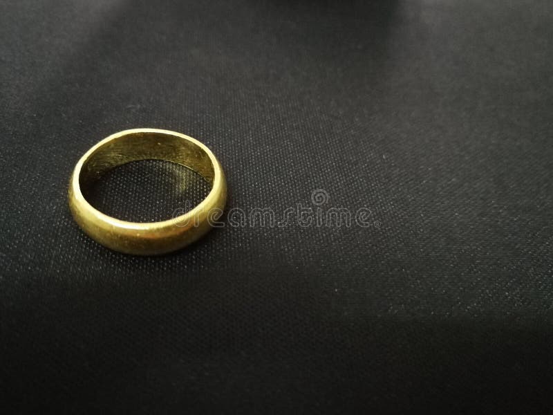 A Gold Ring on Black Background Stock Photo - Image of black, selflove ...