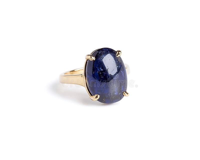 A Gold Ring with a Blue Stone in the Center Stock Photo - Image of ...