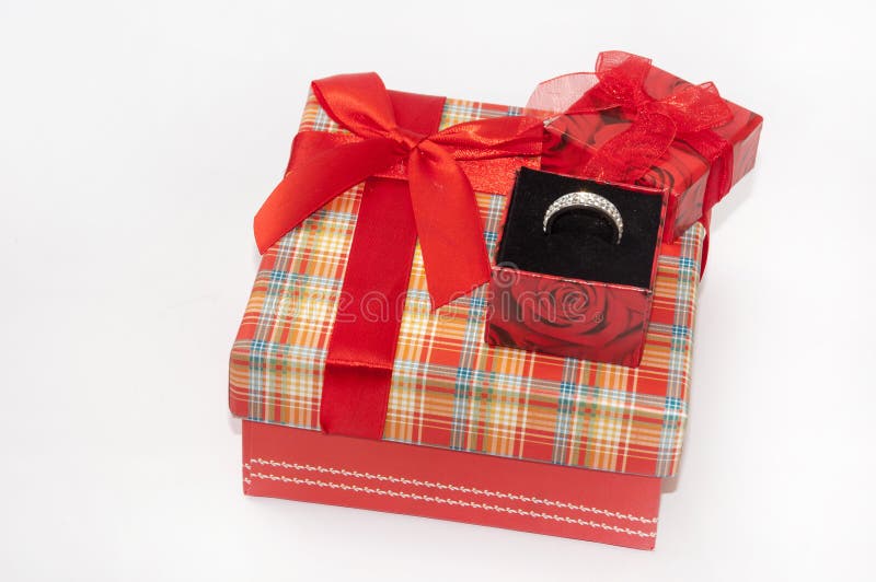 Gold Ring in a Box on a Red Box with a Beautiful Bow Stock Image ...