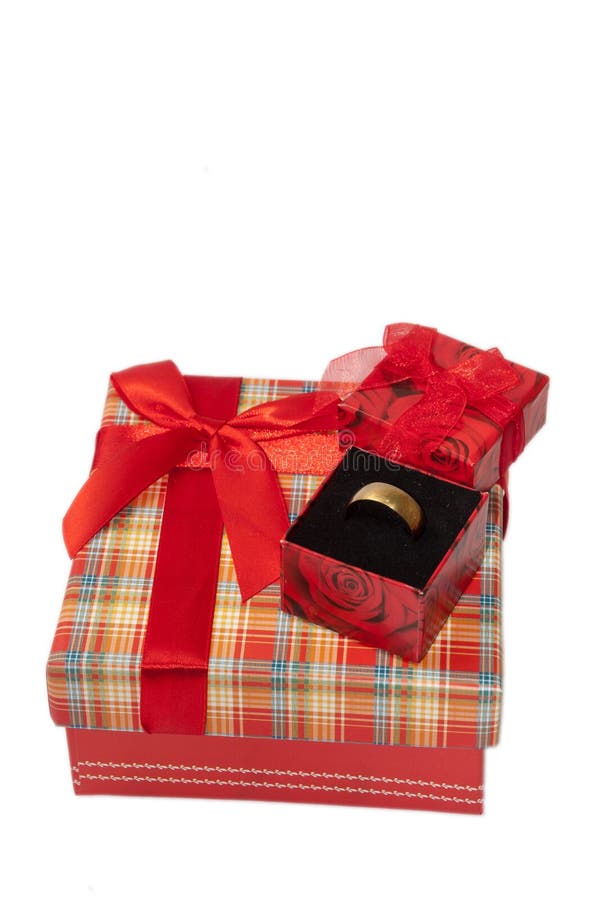 Gold Ring in a Box on a Red Box with a Beautiful Bow Stock Photo ...