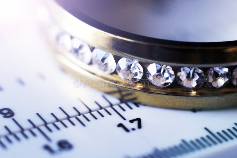 Gold Ring with Diamonds and a Measuring Instrument, the Value of ...