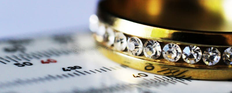 Gold Ring with Diamonds and a Measuring Instrument, the Value of ...