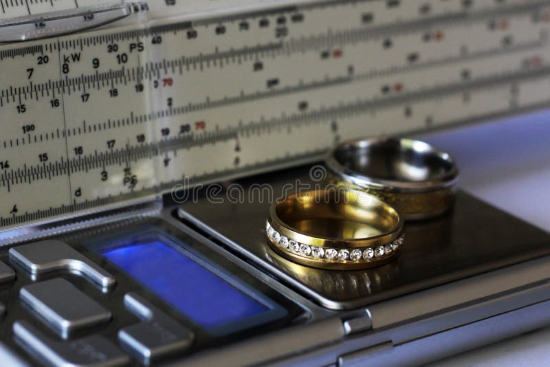 Gold Ring with Diamonds and a Measuring Instrument, the Value of ...
