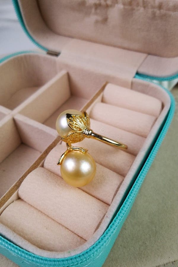 Gold Ring with Pearl on a Jewelry Box Stock Image - Image of gold ...