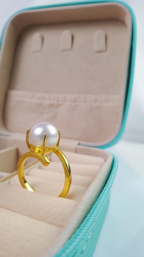 Gold Ring with Pearl on a Jewelry Box Stock Image - Image of jewelry ...