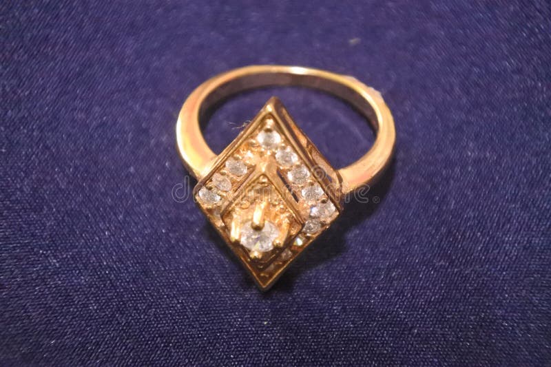 Gold Ring in Prism Shape Plus Beautiful Diamond Stock Photo - Image of ...