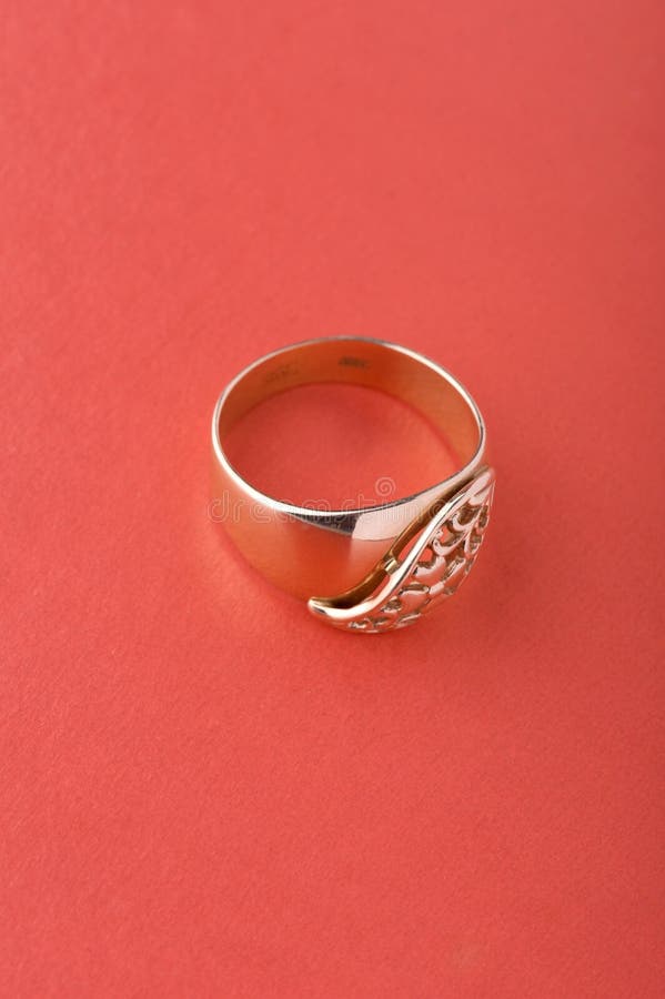 Gold ring on red stock image. Image of gold, adornment - 12794365