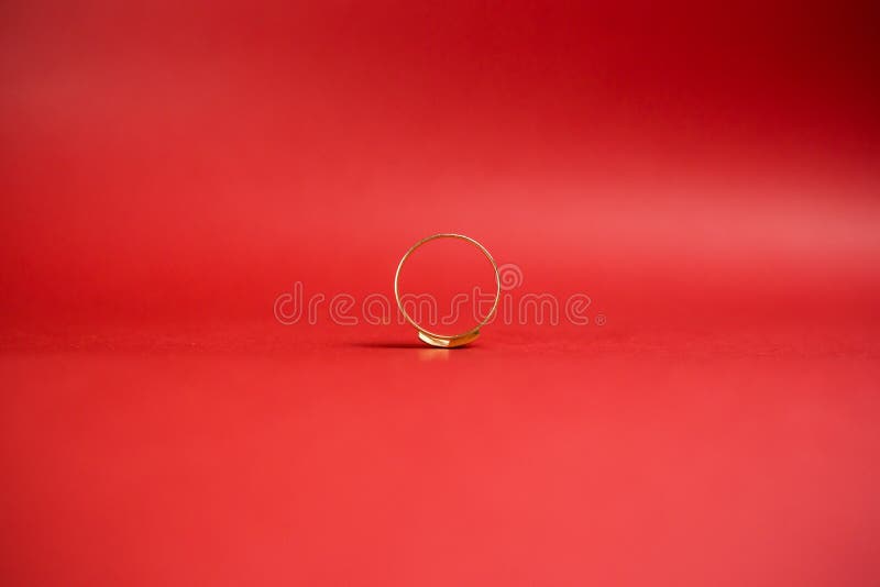 Golden Ring on Red Background Side View Stock Image - Image of golden ...
