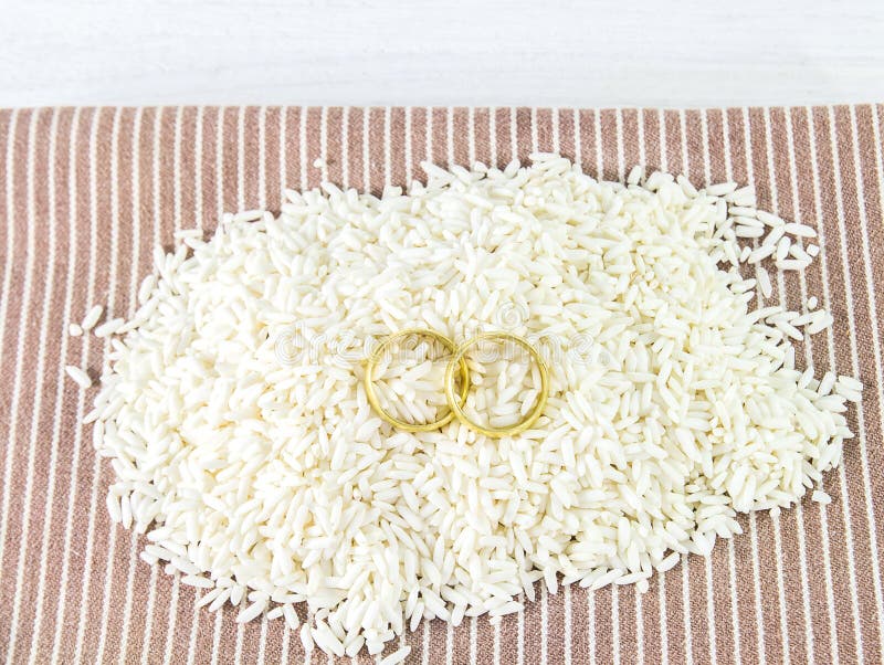 Gold Ring on Rice Seeds on a Brown Cloth Stock Photo - Image of gold ...