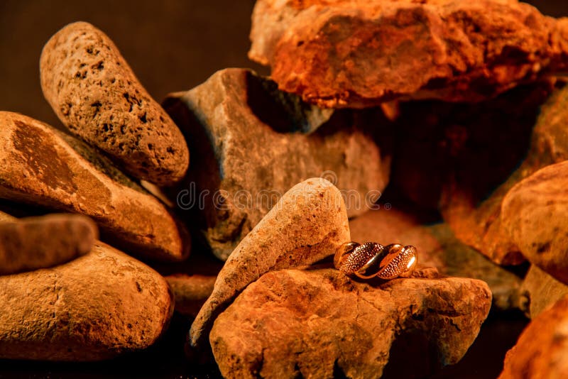 A Gold Ring with Rocks in the River Background Stock Photo - Image of ...