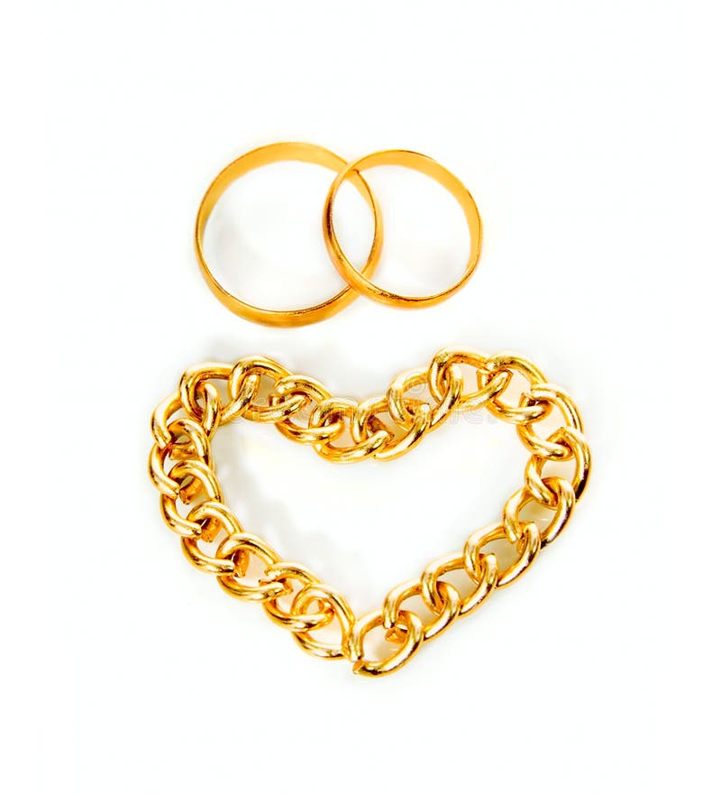 Gold Rings and Heart from Gold Chain Stock Photo - Image of wedding ...
