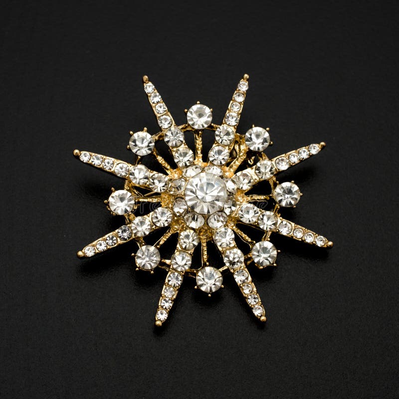 Gold Round Brooch with Diamonds Isolated on Black Stock Image - Image ...