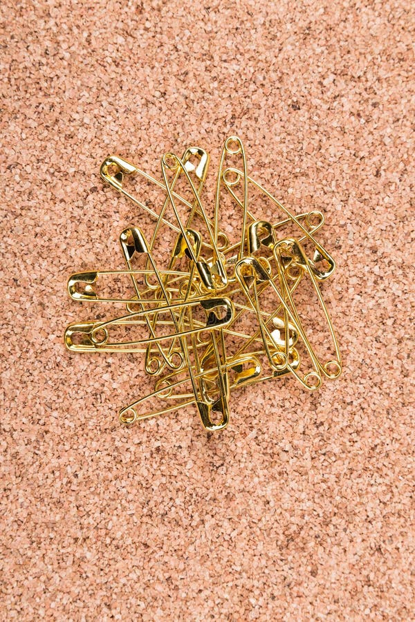 Stack of Gold Colored Safety Pins on Cork Stock Image - Image of diaper ...