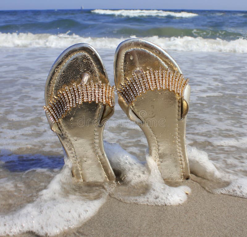 Gold Sandals on a Ocean Beach Stock Photo - Image of decorated ...