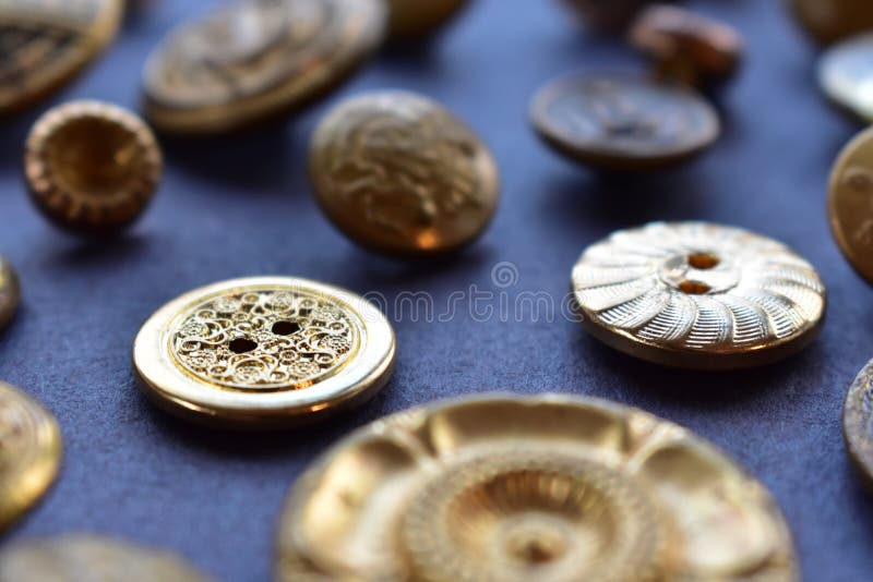 Gold Sewing Buttons On A Blue Background Stock Photo - Image of luxury ...